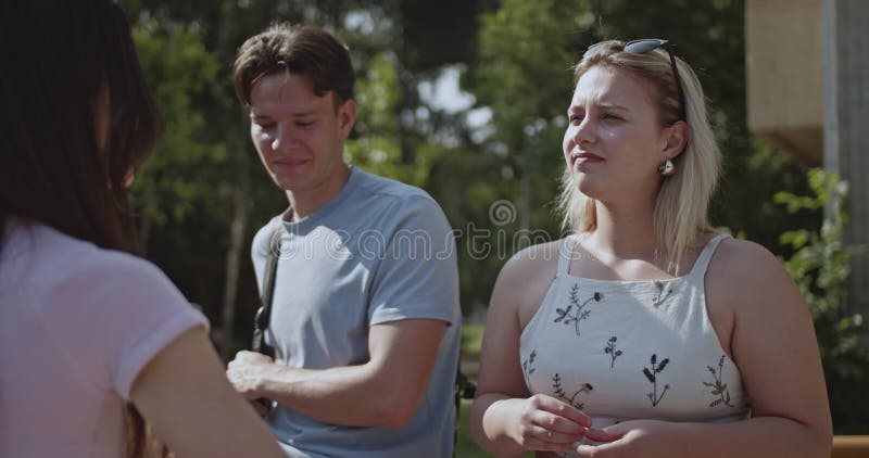 Happy University Students Talking and Laughing Outdoors on a College ...