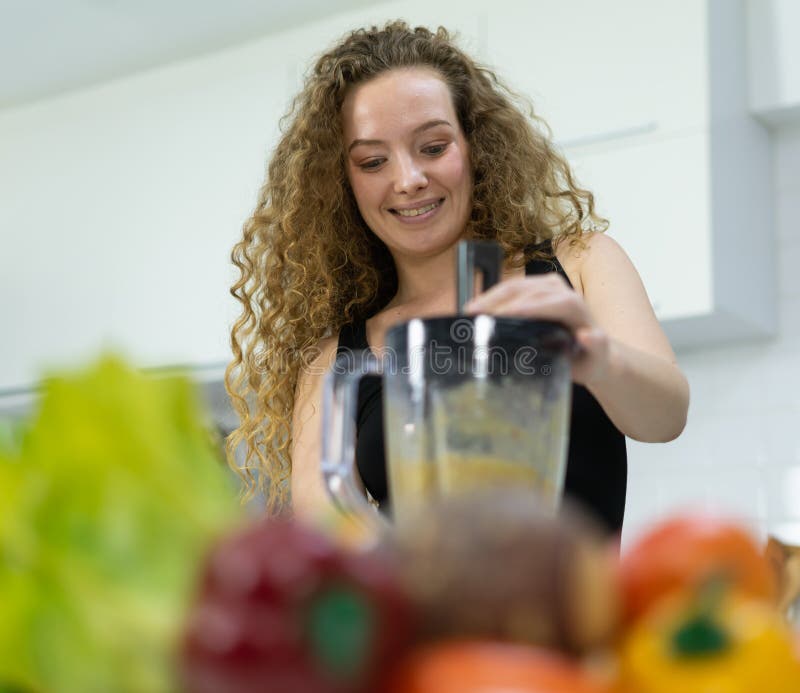 Happy Vegetarian Woman Smile Cooking Healthy Fruit Juice In Blender In