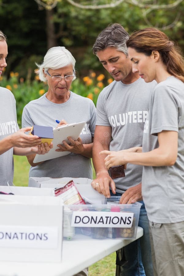 Happy Volunteer Looking at Donation Box Stock Image - Image of charity ...