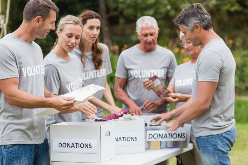 Happy Volunteer Looking at Donation Box Stock Image - Image of holding ...