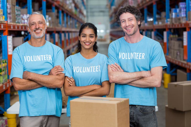 Happy Volunteer are Posing with Crossed Arms Stock Image - Image of ...