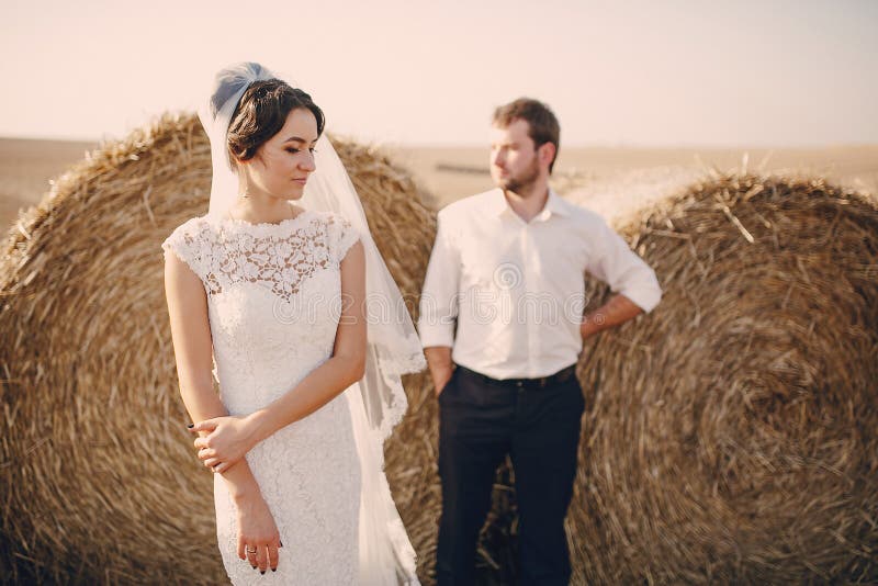 Happy Wedding Couple in a Field Stock Image - Image of outdoors, nature ...