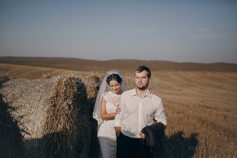 Happy Wedding Couple in a Field Stock Image - Image of fashion ...