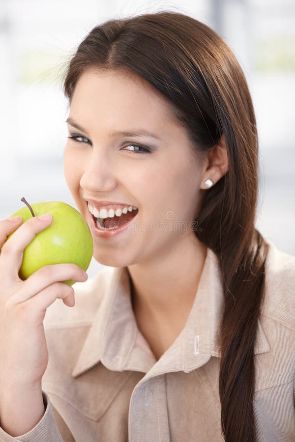 Happy Woman Biting an Apple Smiling Stock Image - Image of happiness ...