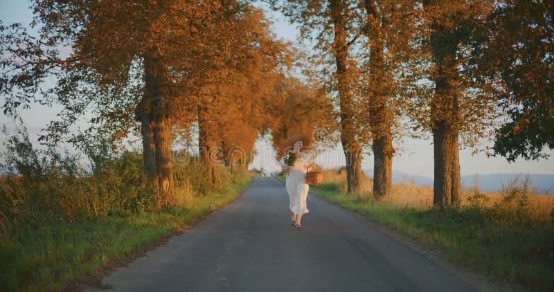 Happy Woman in Boho Style Running Along Tree Alley Stock Video - Video ...