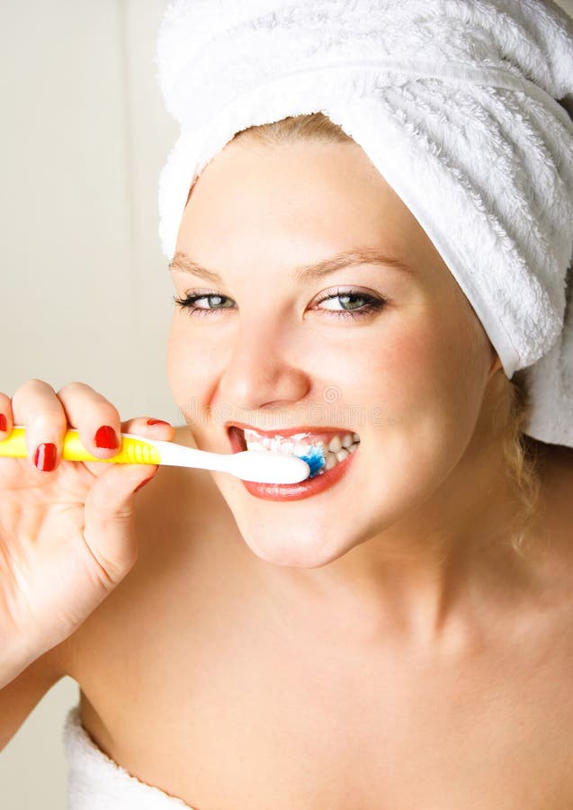 Happy woman brushing teeth stock photo. Image of joyful - 8732104