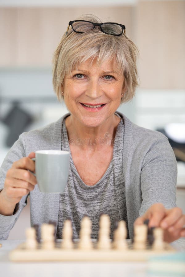 Happy Woman Chess Playing at Home Stock Photo - Image of expression ...