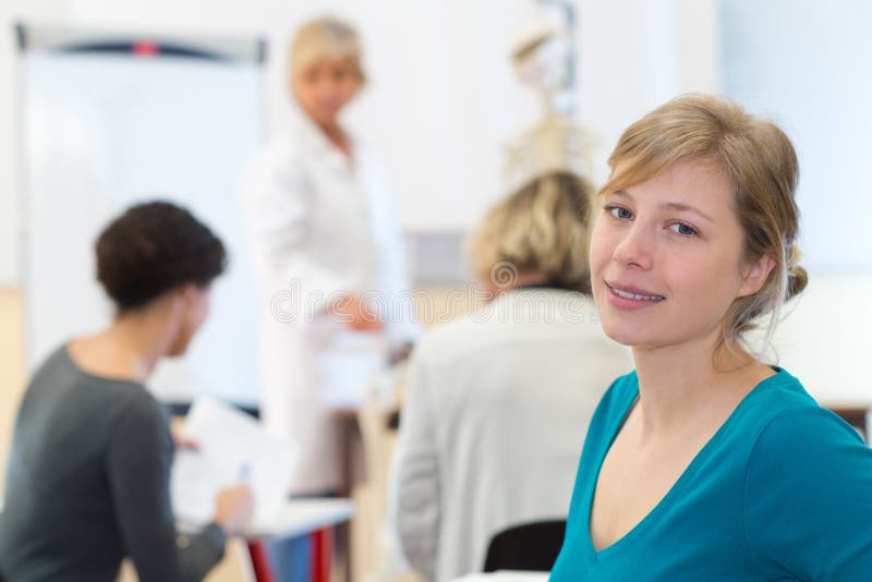 Happy woman in classroom stock photo. Image of meeting - 164147008