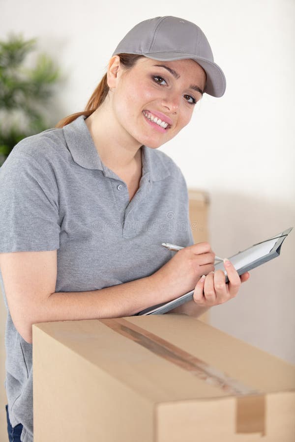 Happy Woman Delivering Packages Holding Clipboard Stock Photo - Image ...