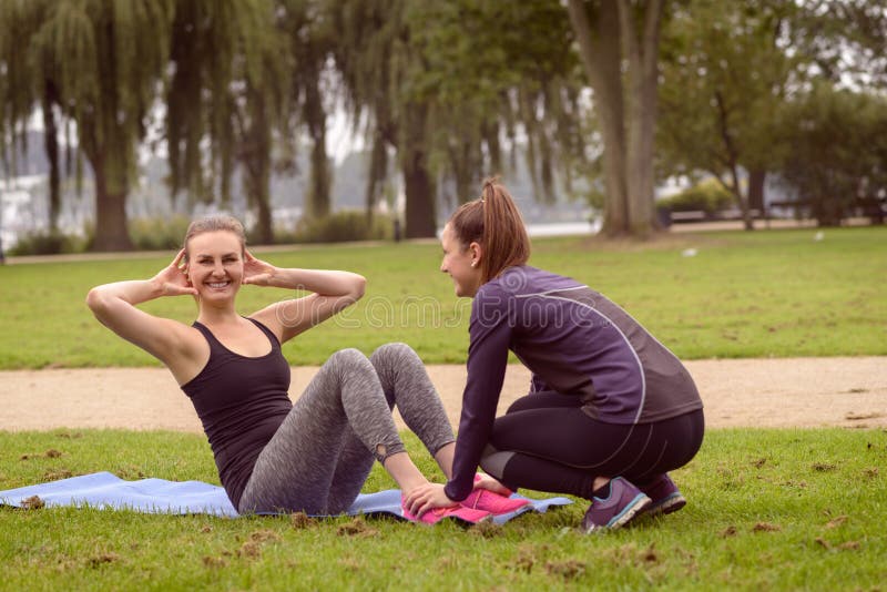Happy Woman Doing Curl Up Exercise Stock Image - Image of helping ...