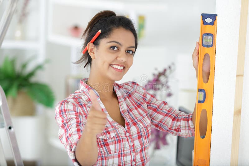 Happy woman doing diy stock photo. Image of tape, girl - 204652876
