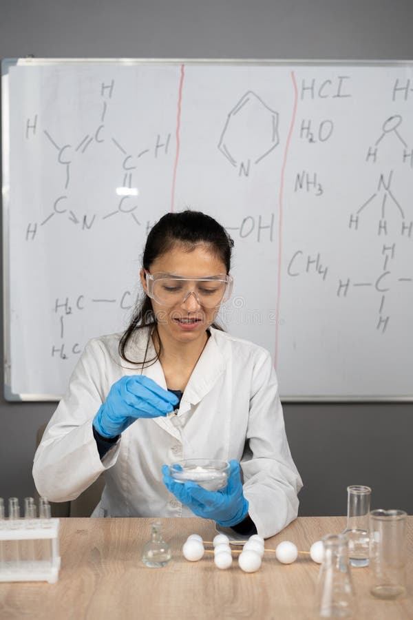 Happy Woman Doing Experiments in the Laboratory. Science and Education ...