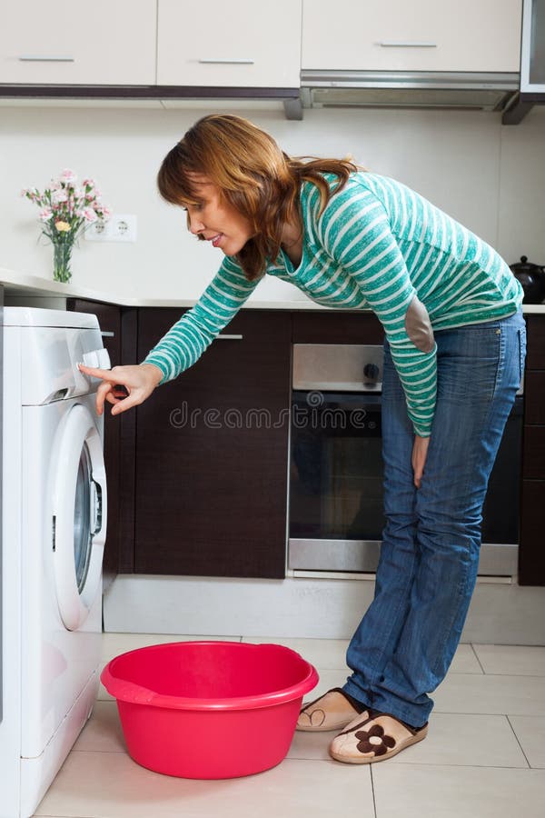 Happy woman doing laundry stock photo. Image of clothes - 39935918