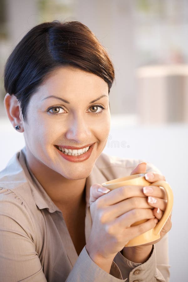 Happy woman drinking tea stock photo. Image of female - 16808408