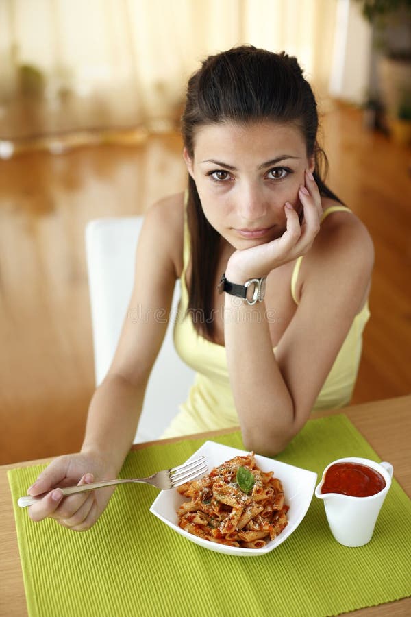 Happy woman eating pasta stock photo. Image of adult - 27847554