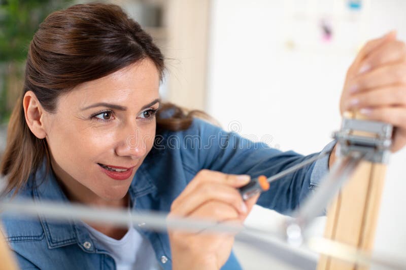 Happy Woman Fixing Broken Lamp Stock Image - Image of lifeevent, future ...