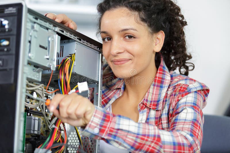 Happy Woman Fixing Computer at Desk at Work Stock Photo - Image of ...
