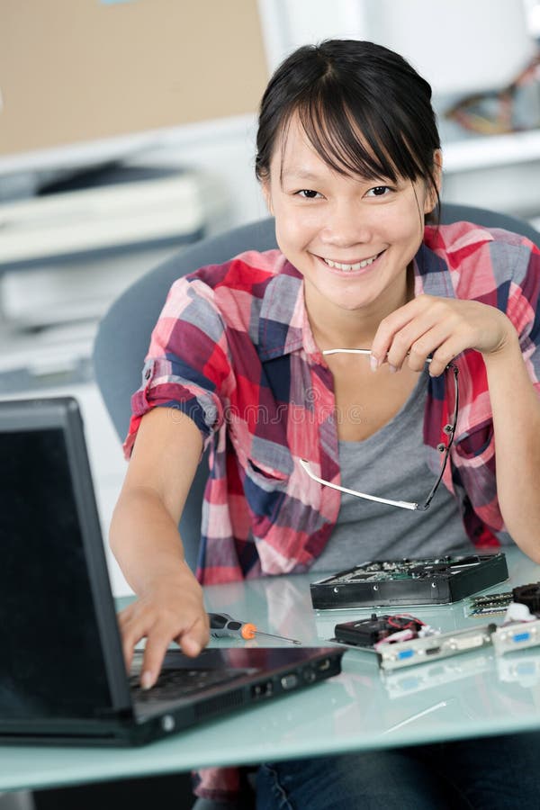 Happy woman fixing pc stock photo. Image of electronic - 188229216