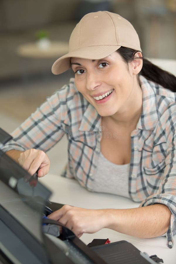 Happy woman fixing printer stock image. Image of printer - 201722615