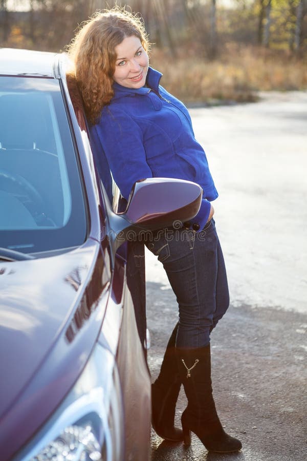Happy Woman in Full Length Leaned Against Car Stock Photo - Image of ...