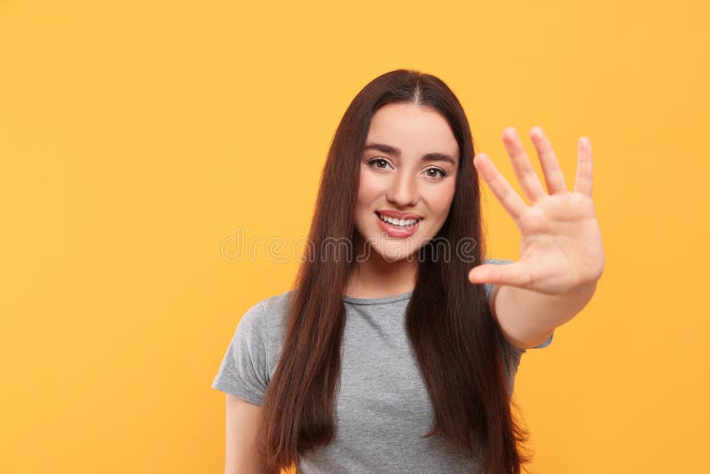Happy Woman Giving High Five on Orange Background, Space for Text Stock Photo - Image of adult ...