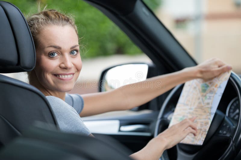 Happy Woman Got Lost while Driving Car Stock Image - Image of ...