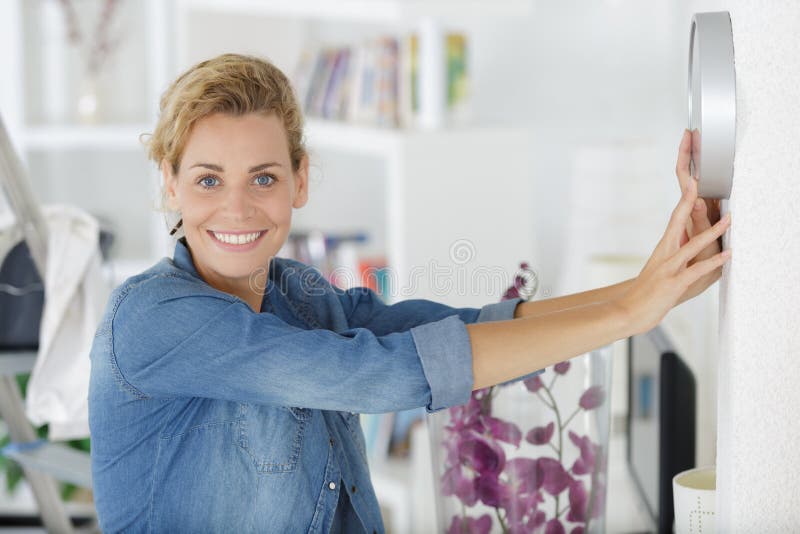 116 Woman Hanging Wall Clock Stock Photos - Free & Royalty-Free Stock ...