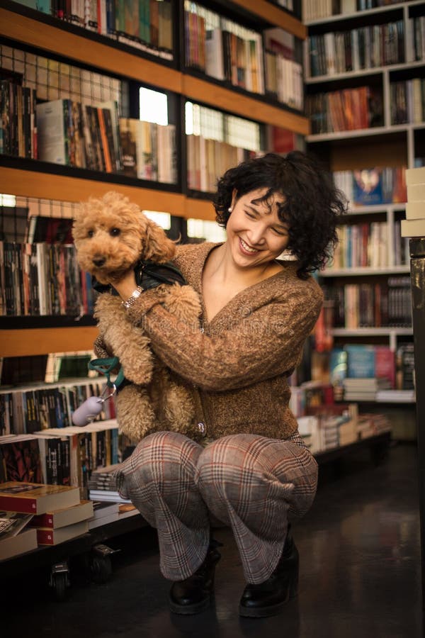 Woman with Her Dog in Library Stock Photo - Image of girl, bookshop ...