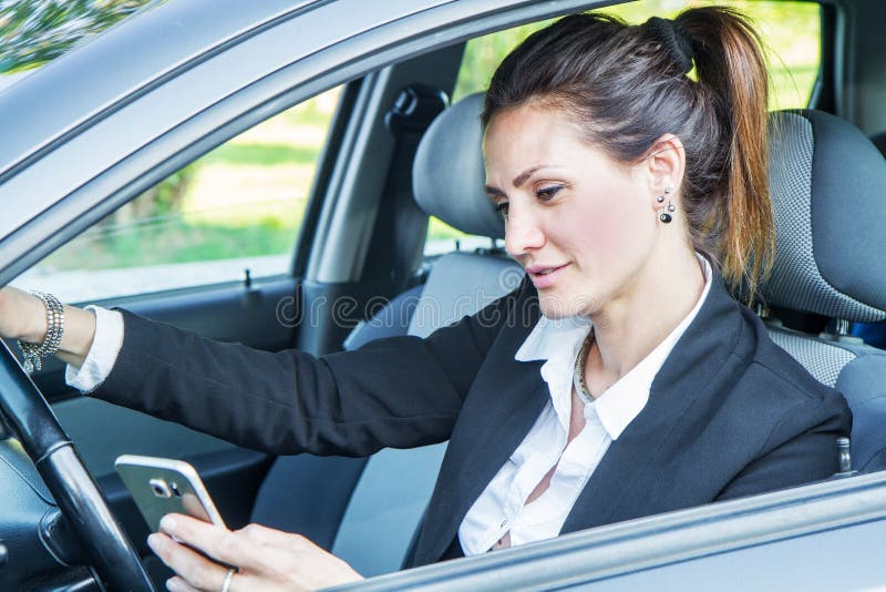 Happy Woman in His New Car with Mobile Phone Stock Image - Image of ...