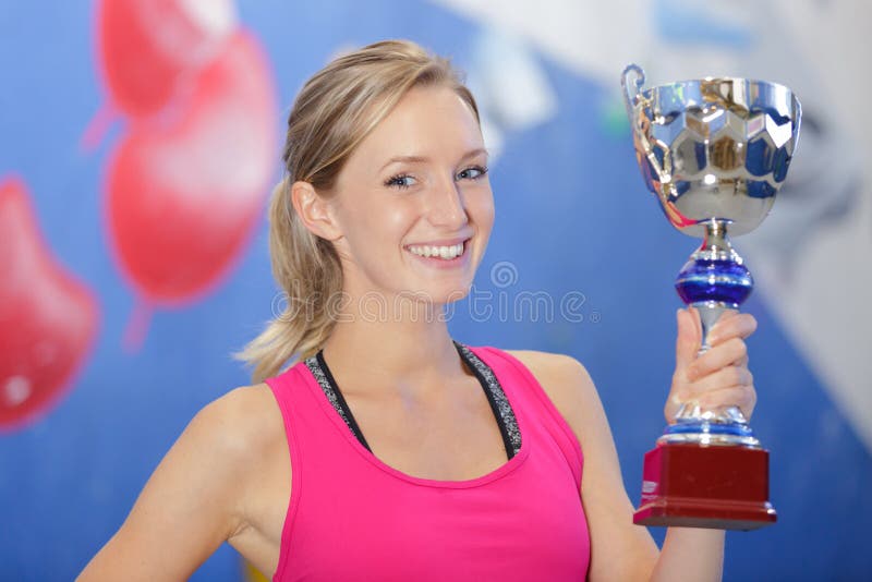 Happy woman holding trophy stock image. Image of award - 162598459