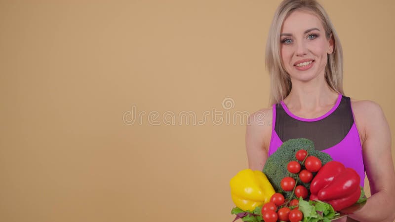 Woman Holding Vegetables with Stunning Flower Arrangement in Hands ... Woman Holding Vegetables with Stunning Flower Arrangement in Hands ...