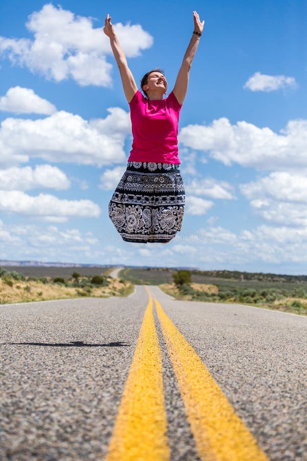 Happy Woman Jumping Over American Road Stock Photo - Image of person ...