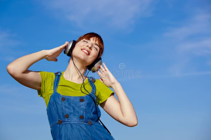 Happy woman listen music stock image. Image of adult - 14564307
