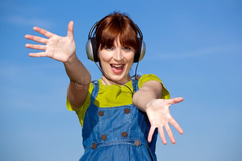 Happy woman listen music stock photo. Image of female - 14647692