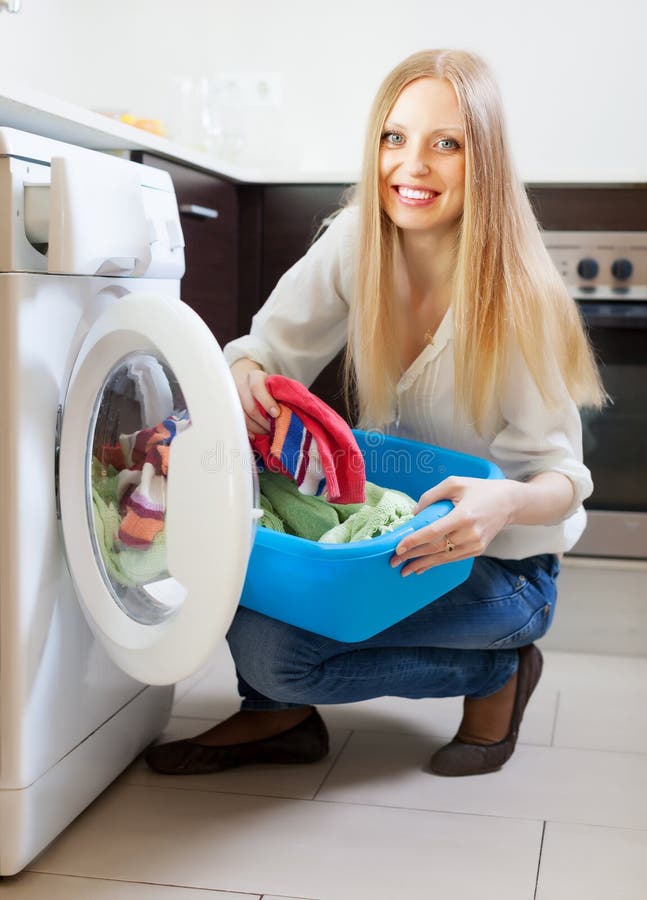 Happy Woman Loading the Washing Machine Stock Photo - Image of ...