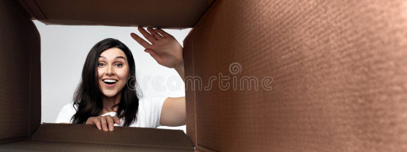 Happy Woman Looking into Cardboard Box, Bottom View Stock Photo - Image ...