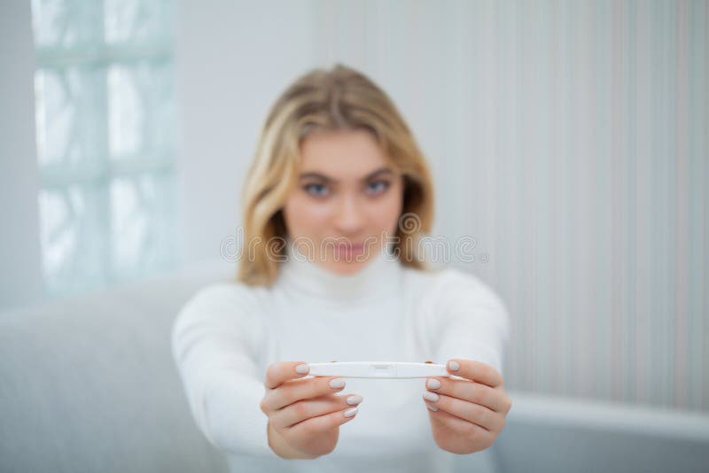 Happy Woman Looking at a Pregnancy Test after Result. Stock Photo ...