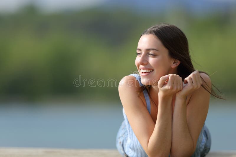 Happy Woman Looking at Side in a Pier Stock Image - Image of enjoying ...
