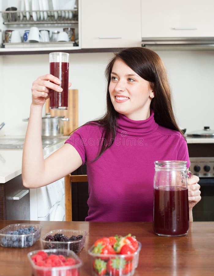 Happy Woman Making Fresh Beverages with Berries Stock Photo - Image of ...