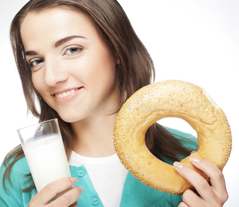 Woman with milk and donut stock photo. Image of elegant - 186901220