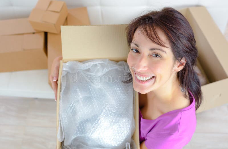 Happy woman moving house stock image. Image of home - 122036165