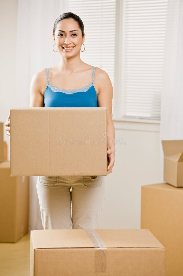 Woman Moving into New Home Hanging Picture Stock Image - Image of ...