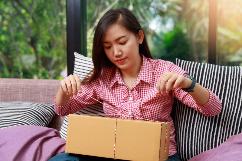 Happy Woman Opening Parcel Box at Home Stock Image - Image of package ...