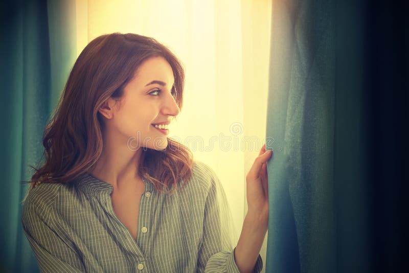 Happy Woman Opening Window Curtains Stock Photo - Image of light, hope ...