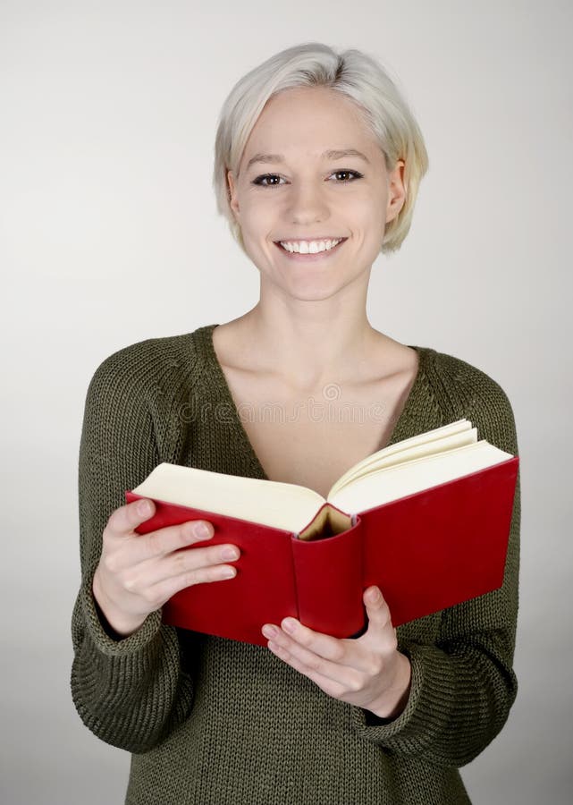 Happy woman reading book stock photo. Image of thoughtful - 76626542