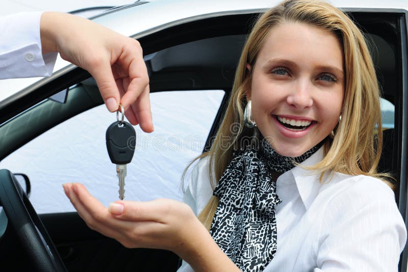 Woman Receiving Car Key from Salesman Stock Photo - Image of receiving ...
