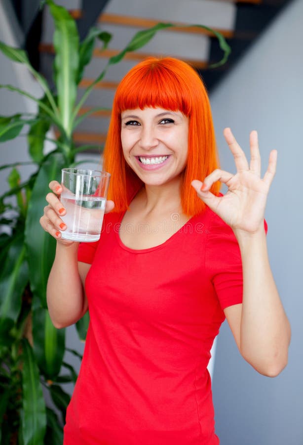 Happy Woman in Red Drinking Water Stock Photo - Image of female ...