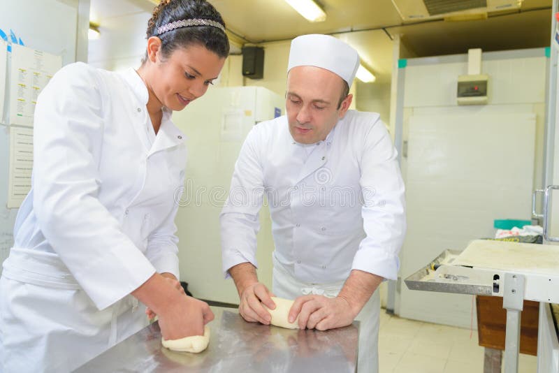 Happy Woman with Rolling-pin Talking To Chef Stock Photo - Image of ...