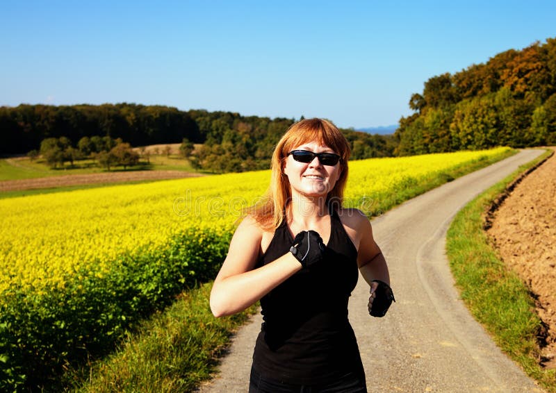 Happy Woman Running in a Field Stock Photo - Image of summer, health ...