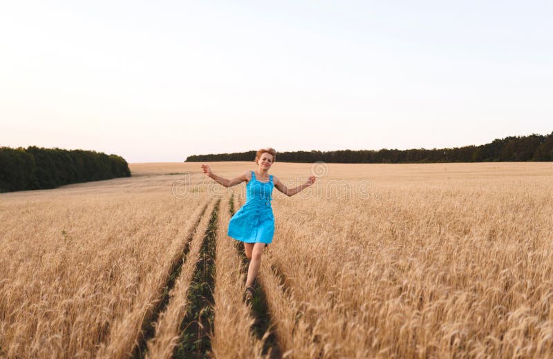 Happy Woman Running in Field Stock Image - Image of sunflower, leisure ...